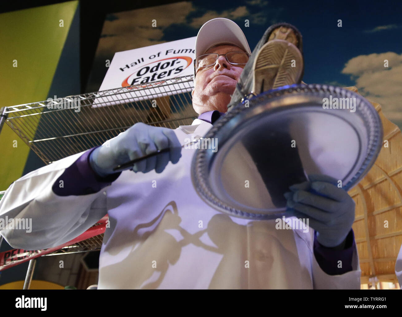 A judge reacts after smelling a sneaker entry at the 42nd annual ...