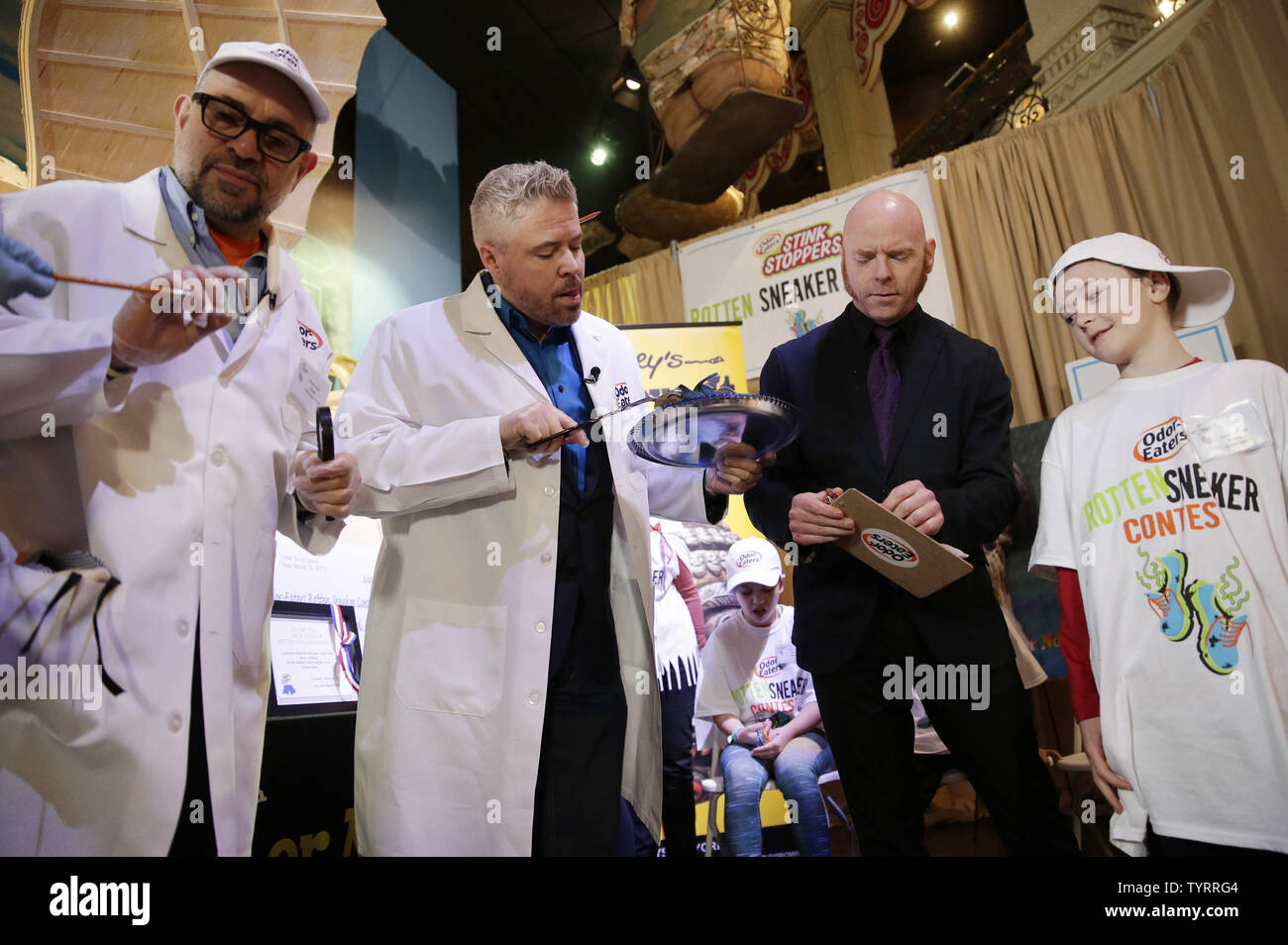 Judges examine a sneaker entry at the 42nd annual National Odor-Eaters ...