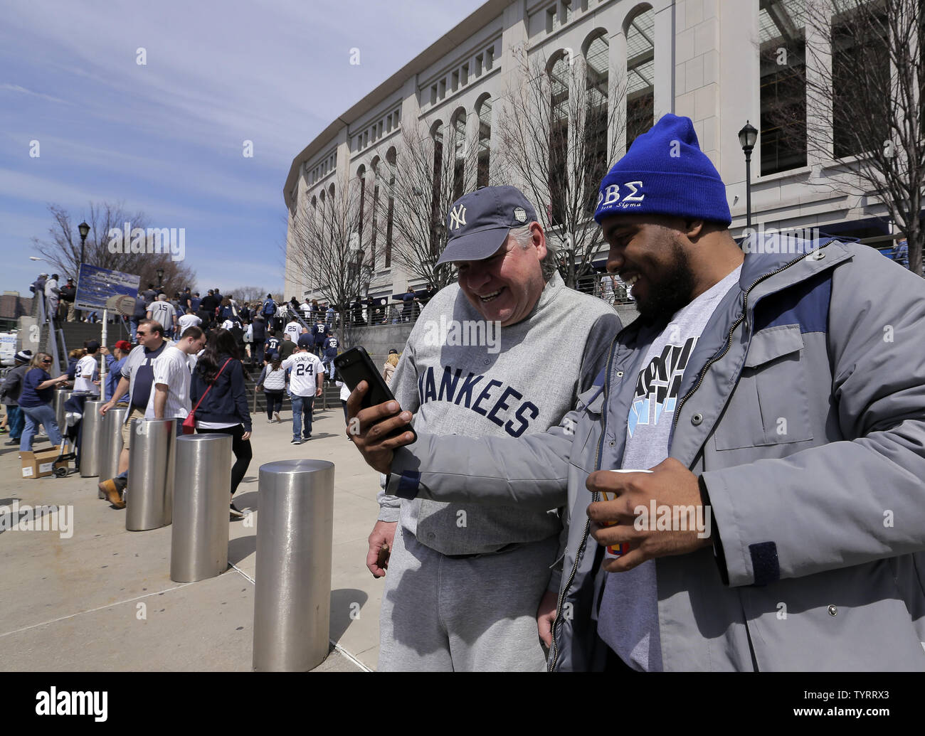 Eddy Stokes (R) shows Kevin Tracy, who is dressed as Babe Ruth, his ...