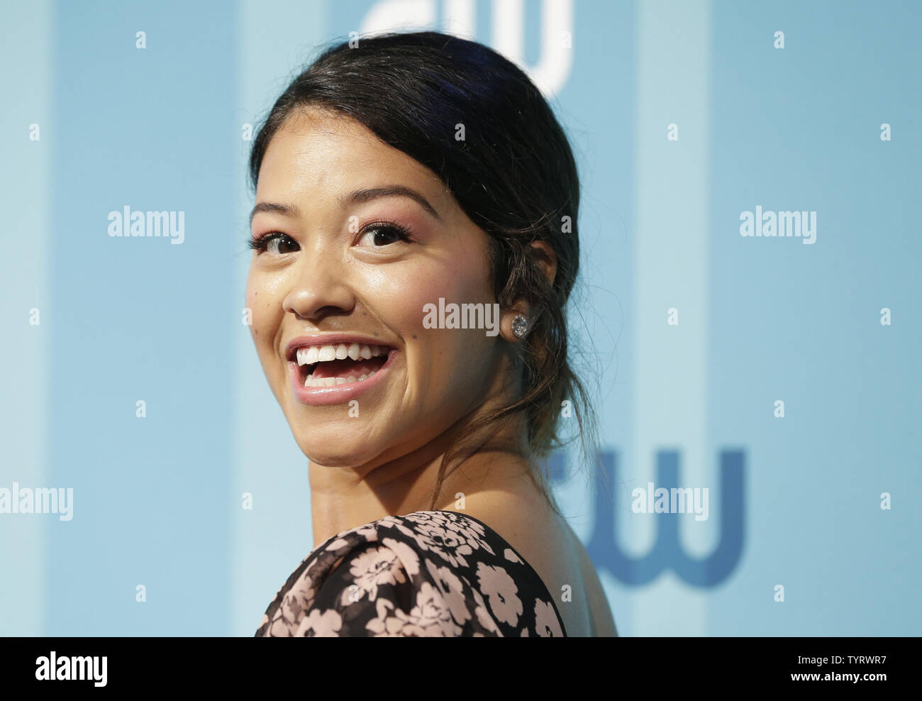 Gina Rodriguez arrives on the red carpet at the 2017 CW Upfront at the ...