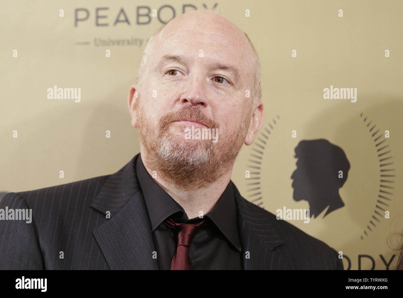 Louis C.K. arrives in the press room with an award at the 76th Annual ...