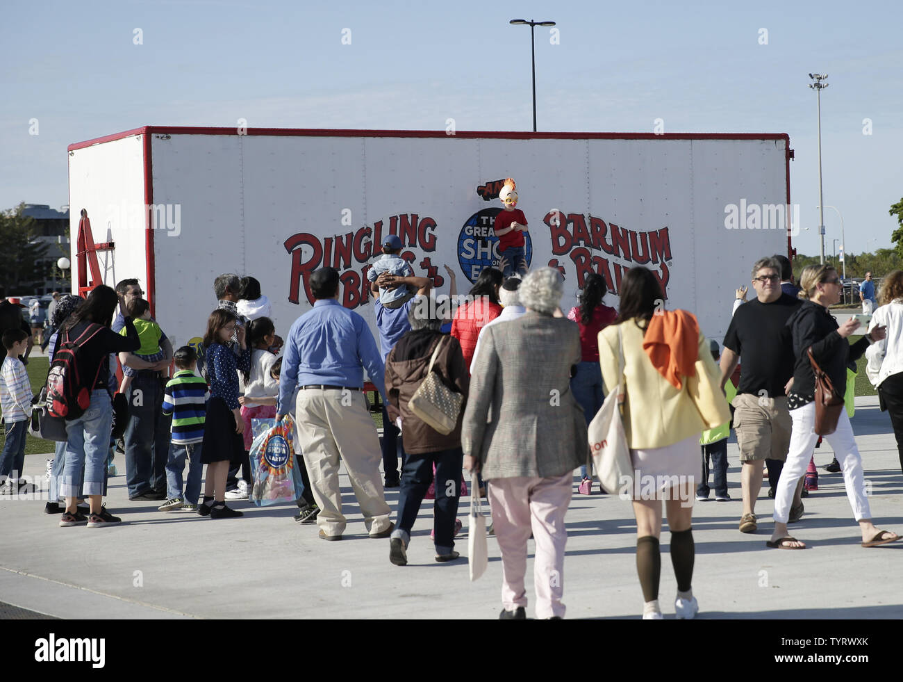 People take photos near a circus trailer on the final day of ...