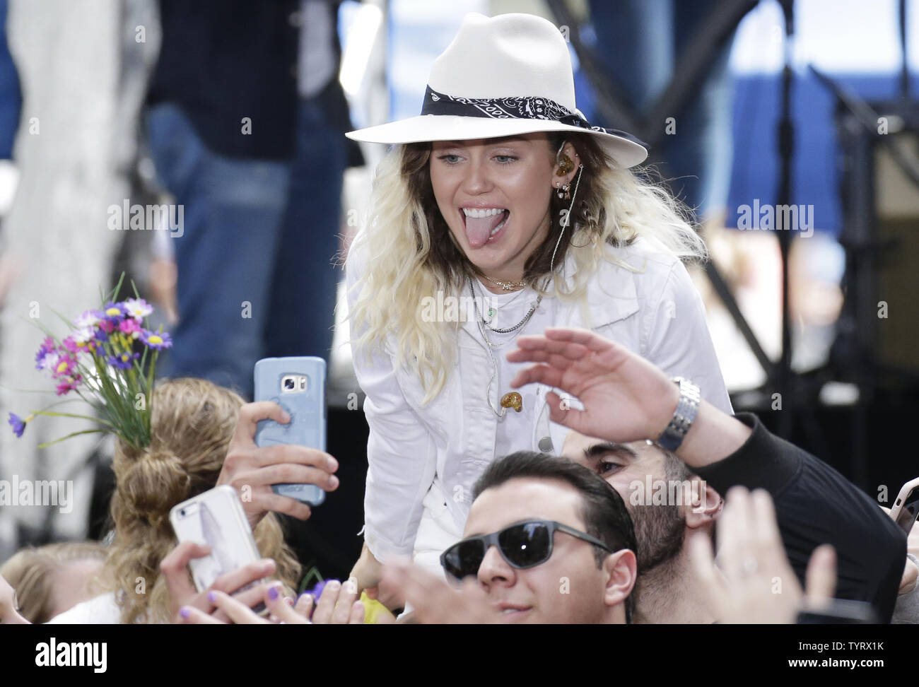 Miley Cyrus sticks out her tongue when she performs on the NBC Today ...