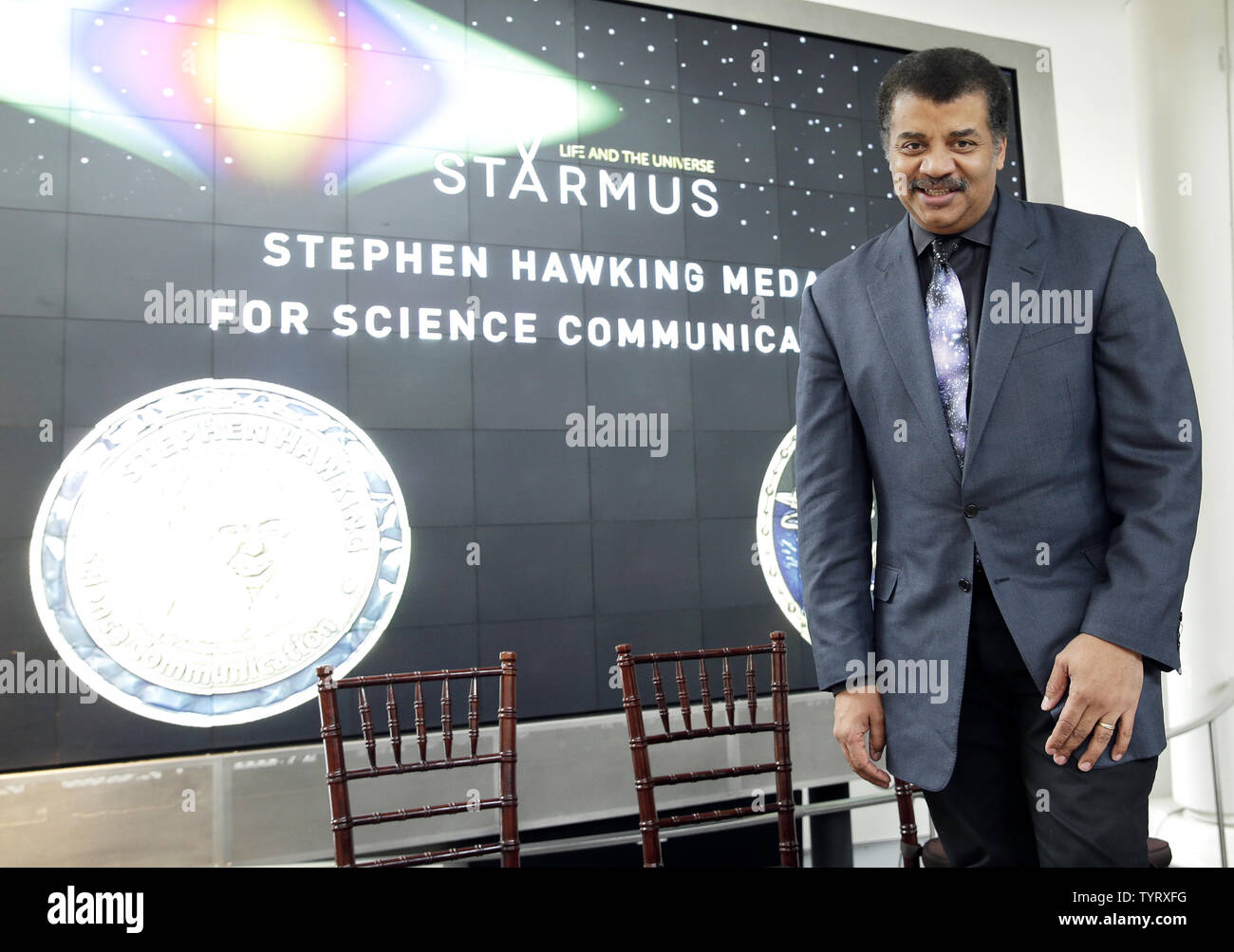 Scientist Dr. Neil deGrasse Tyson arrives at a press event announcing ...