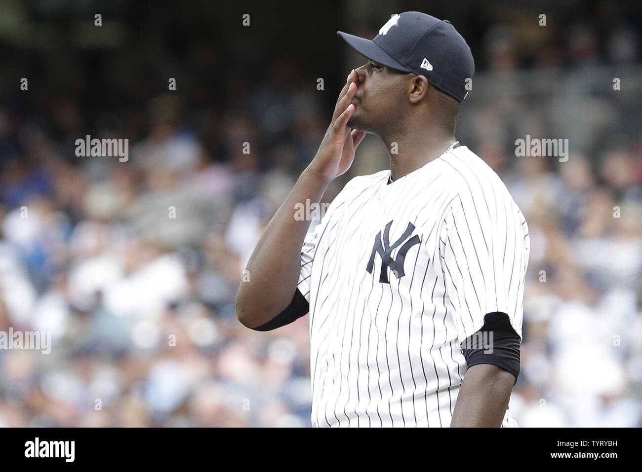 New York Yankees starting pitcher Michael Pineda puts his hand to his ...