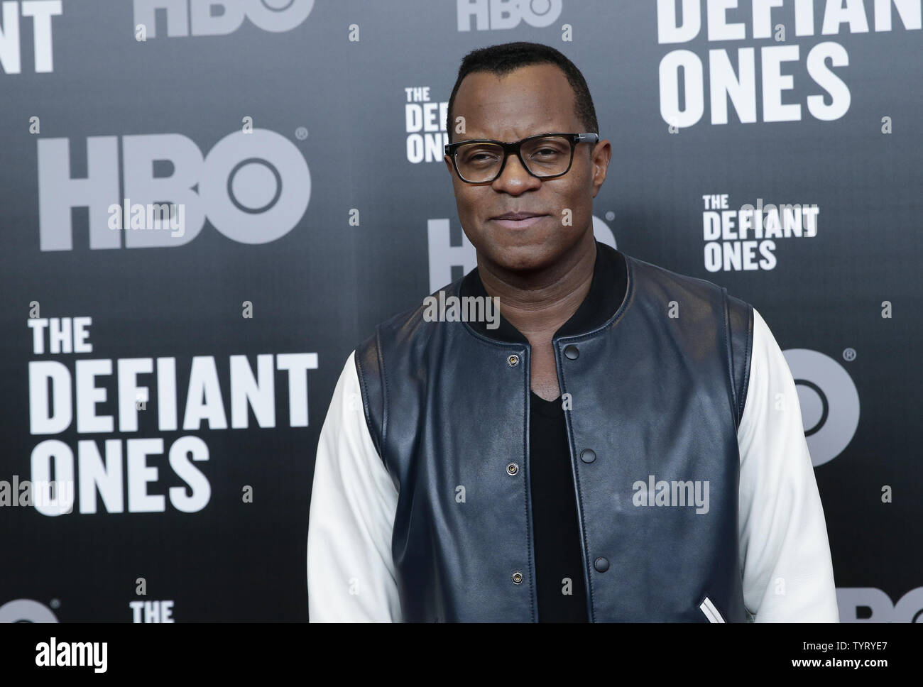 Geoffrey Fletcher arrives on the red carpet at 'The Defiant Ones ...