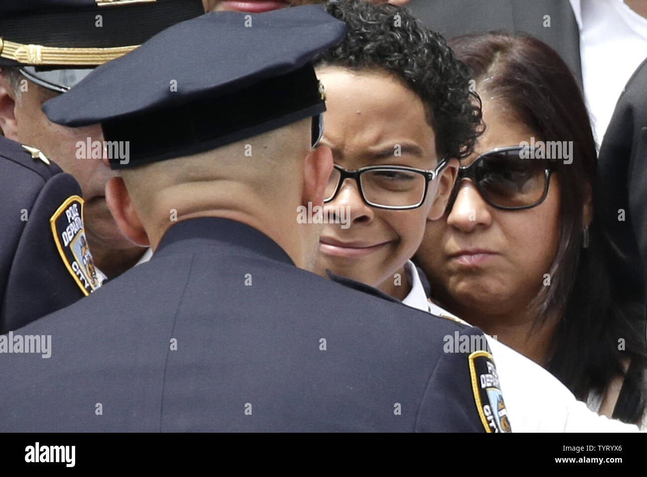 Peter, the son of fallen Police officer Miosotis Familia, reacts when ...