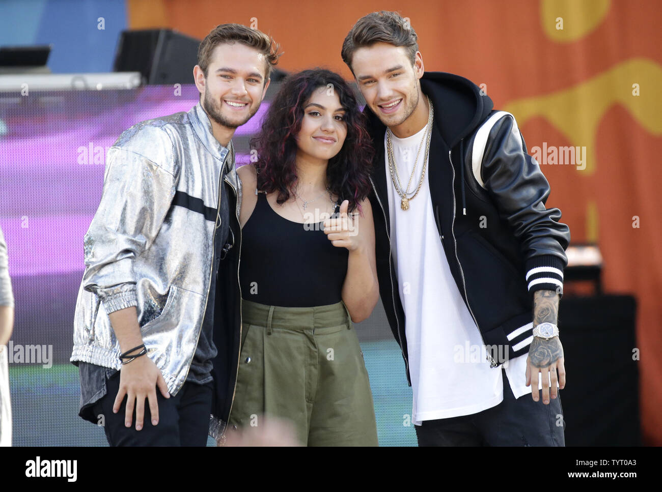 Zedd, Alessia Cara and Liam Payne stand on the stage before they ...