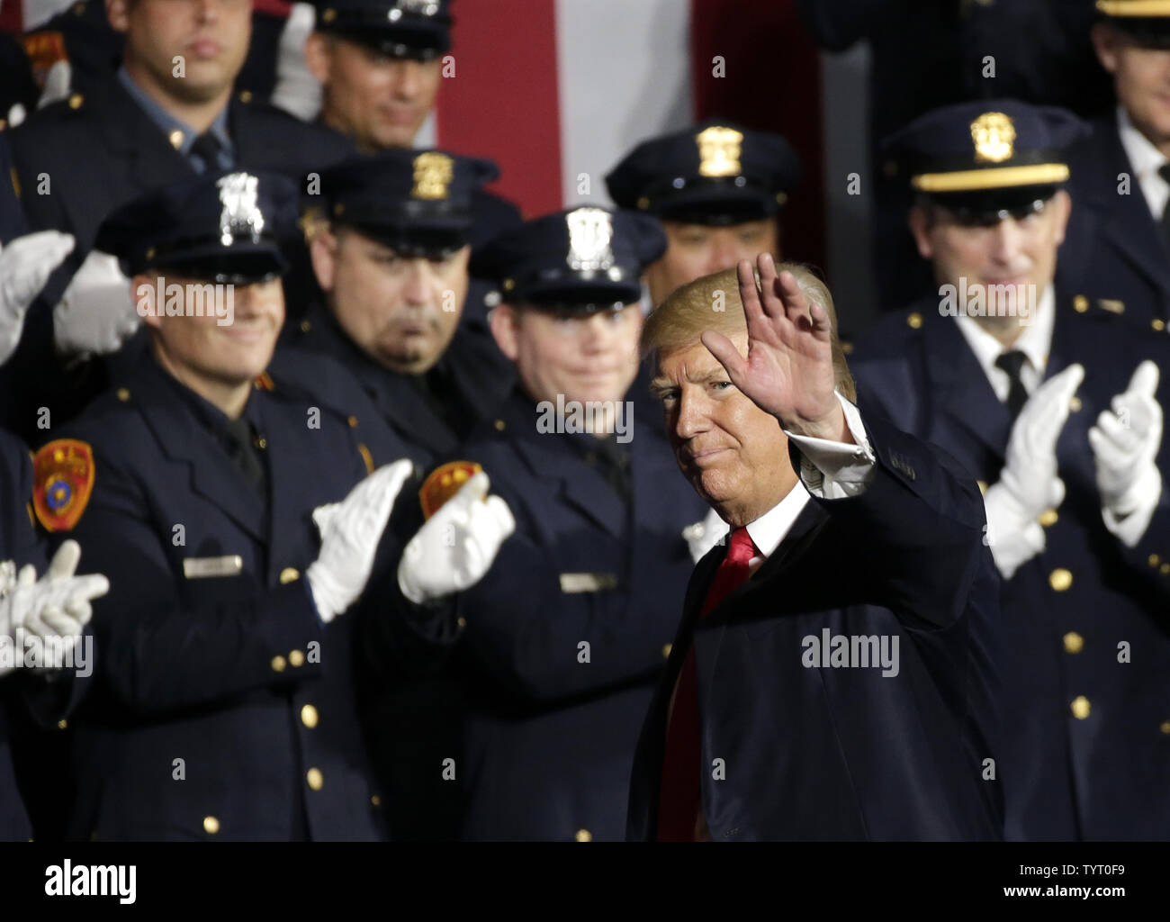 President Donald Trump waves after he delivers remarks on MS-13 to ...