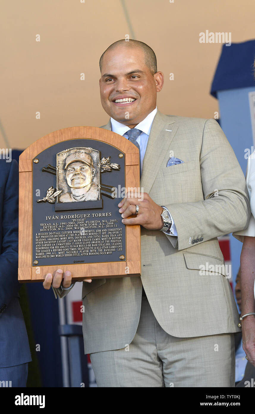 Ivan Rodriguez holds his plaque at the Baseball Hall of Fame induction ...