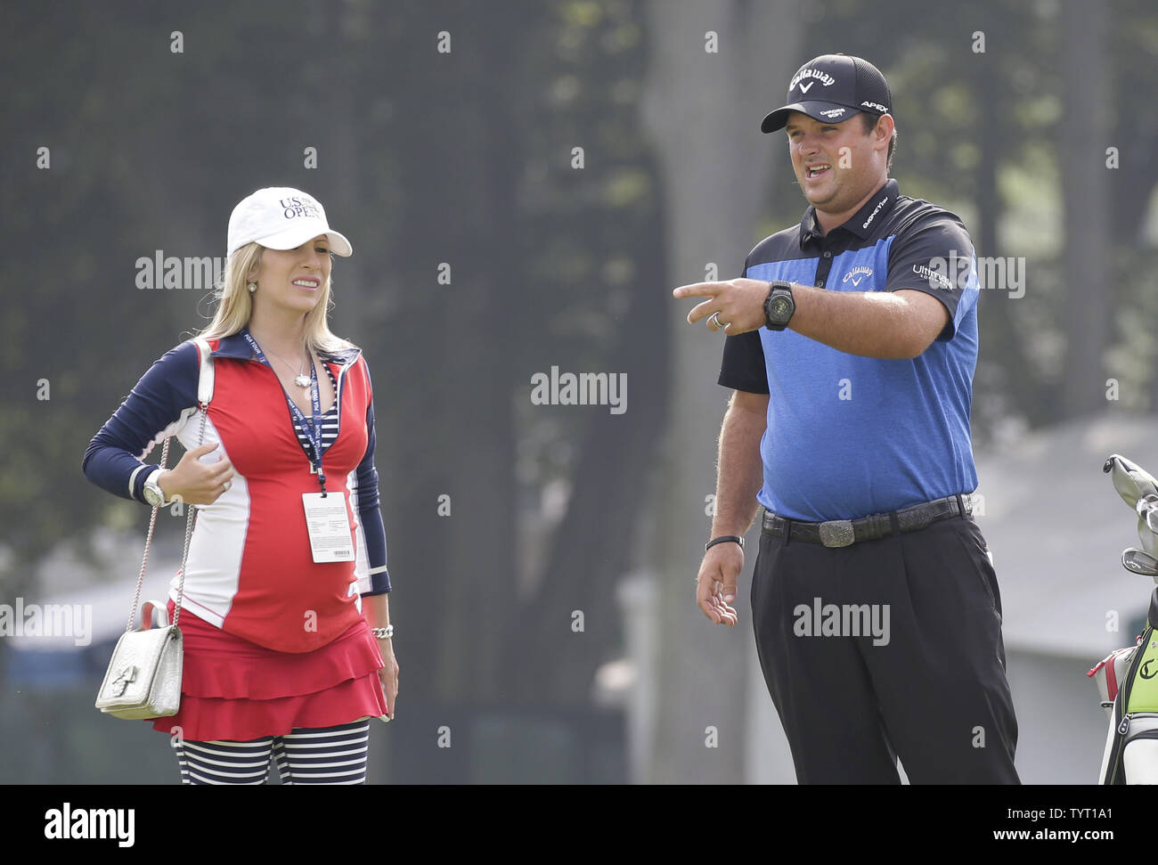 Patrick Reed stands on the practice green with wife Justine at a ...