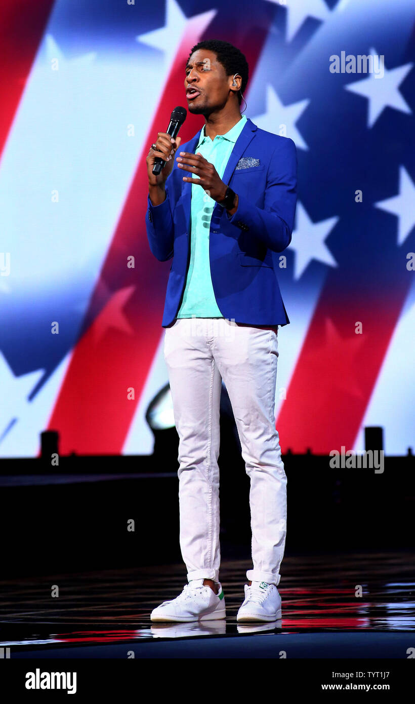 Jon Batiste sings the national anthem during the opening ceremony at ...