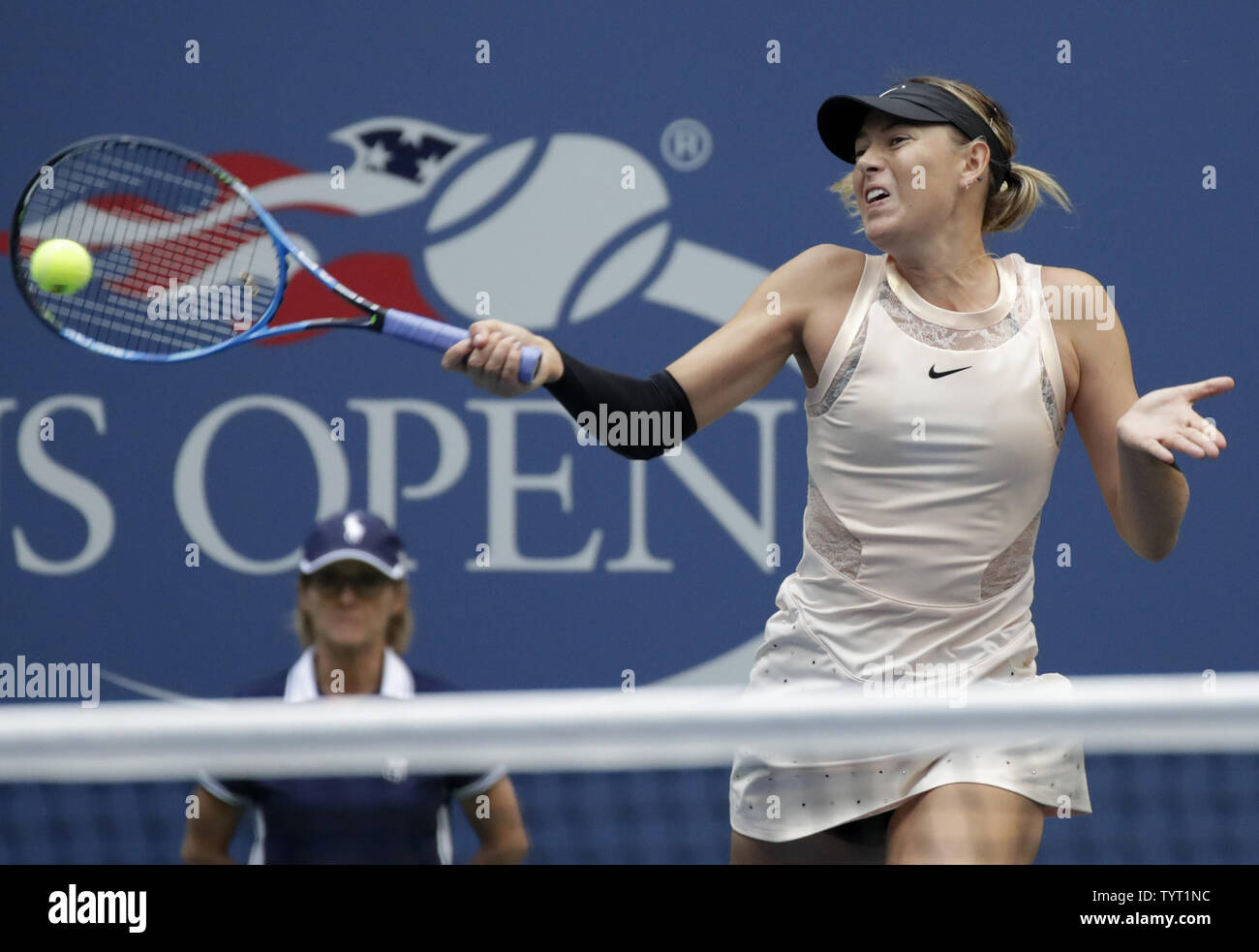 Maria Sharapova of Russia hits a forehand in her 2nd round match against Timea Babos of Hungary ...