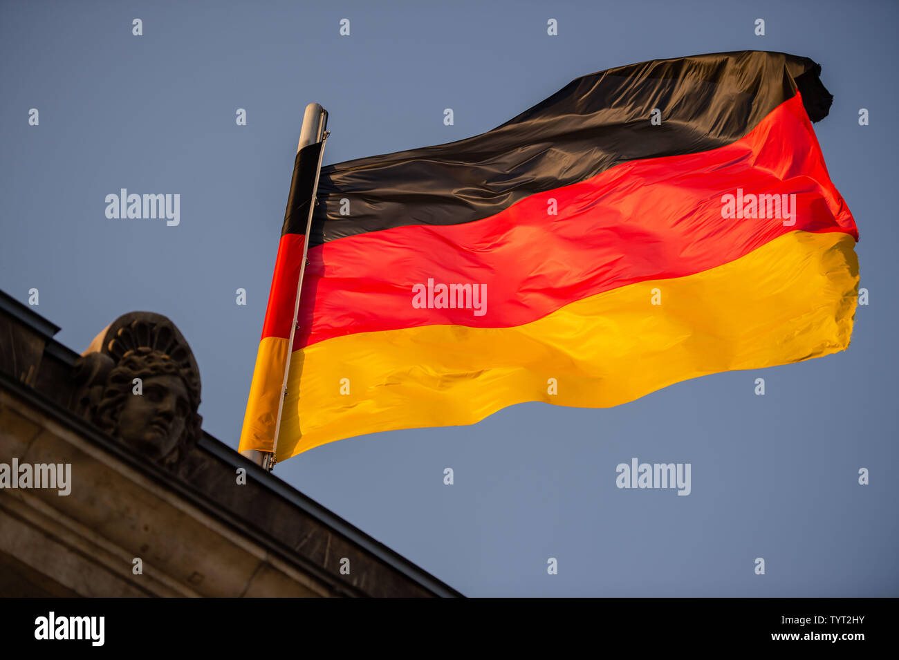 Berlin, Germany. 26th June, 2019. A German flag floats above the roof ...