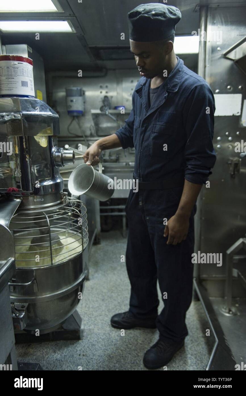SEA (Nov. 24, 2016) Seaman Malik Griffin prepares Thanksgiving dinner ...