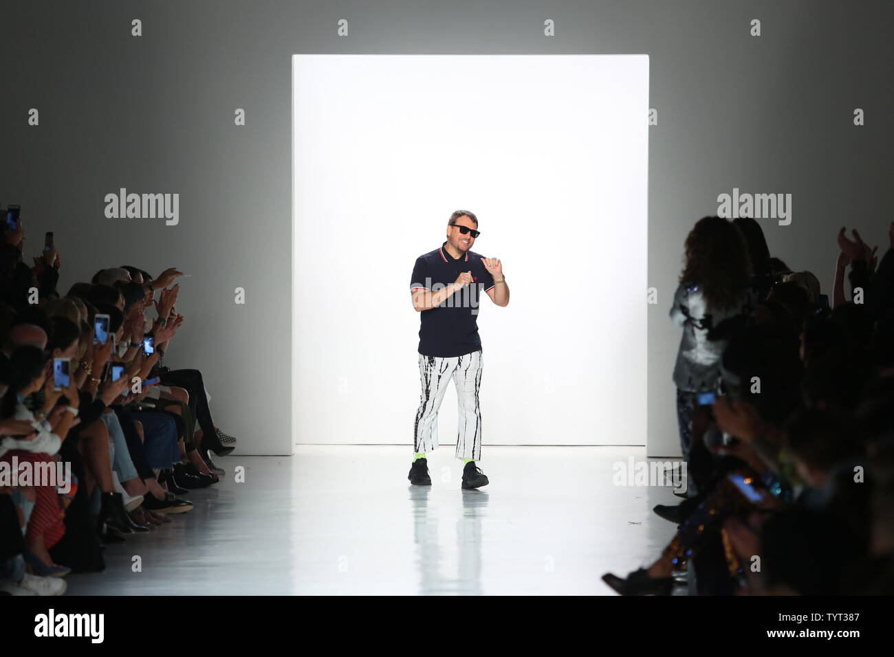 Designer Johnson Hartig walks on the runway at the Libertine fashion ...