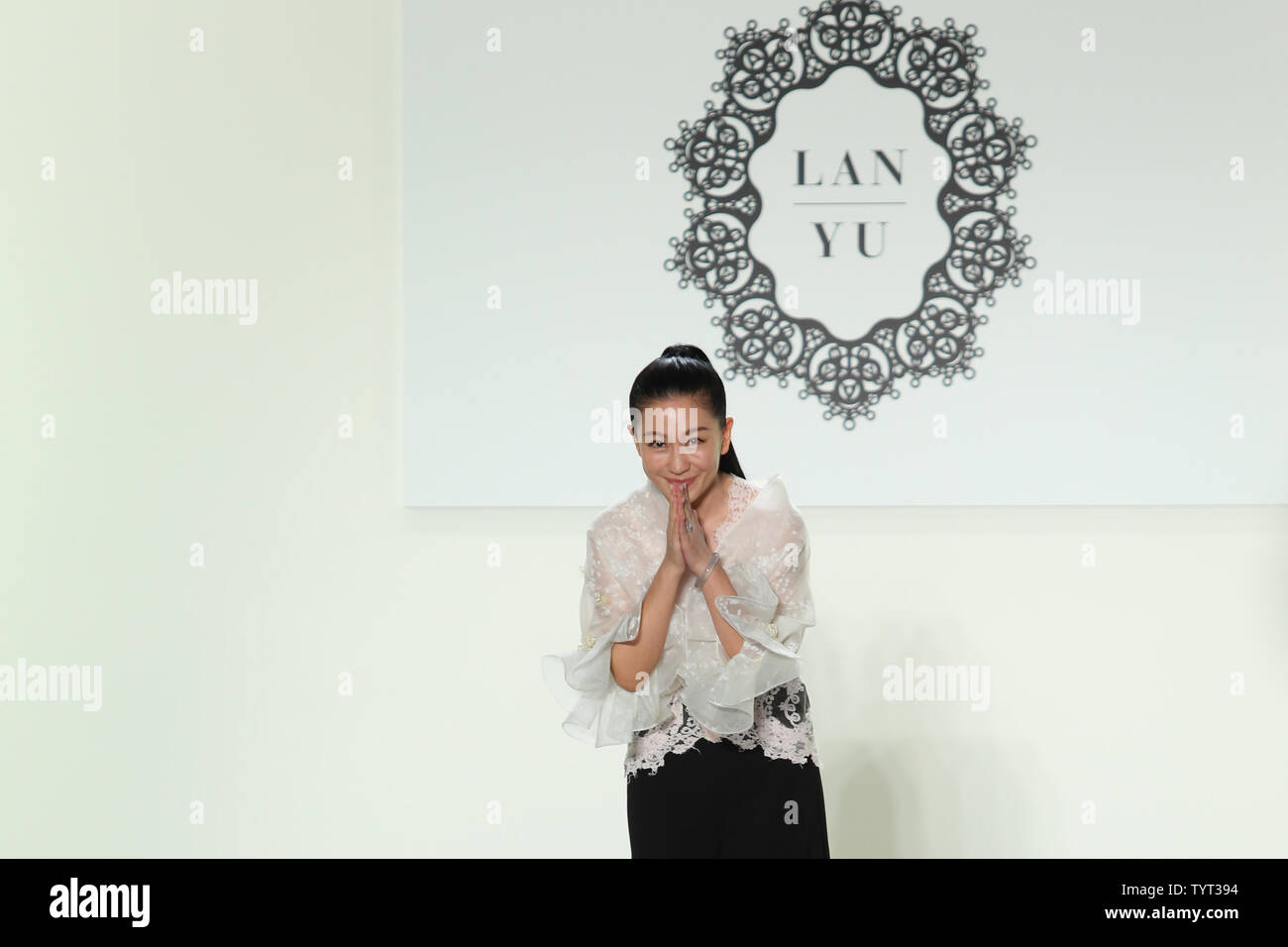 Designer Lan Yu walks on the runway at the Lanyu fashion show during ...