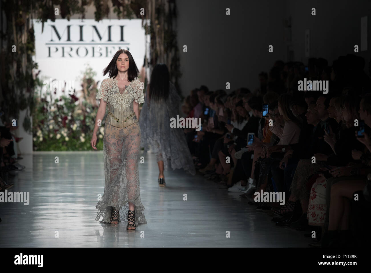 A model walks on the runway at the Mimi Prober fashion show during New ...