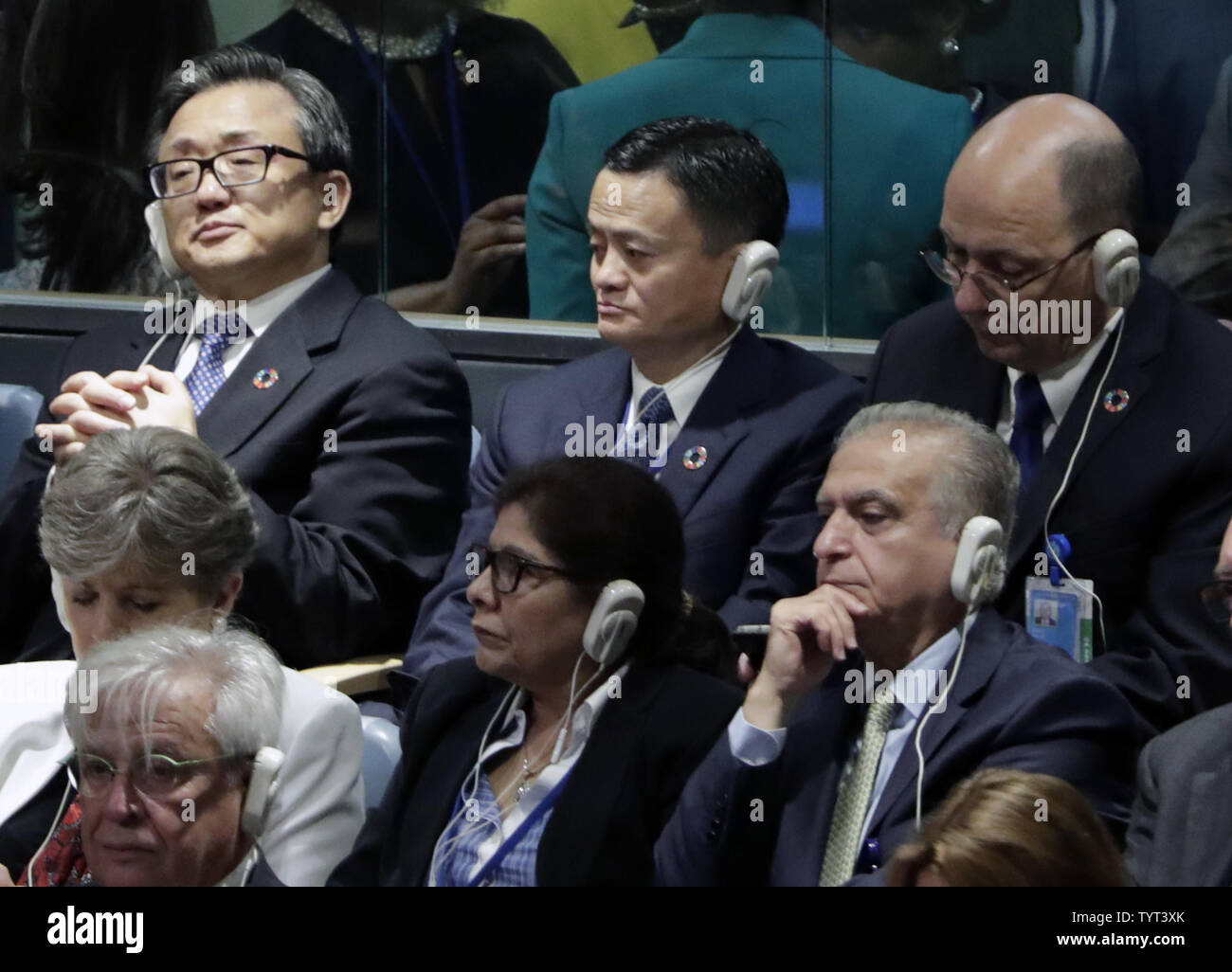 Chairman of Alibaba Group Jack Ma (Top-Center) listens to speeches at ...