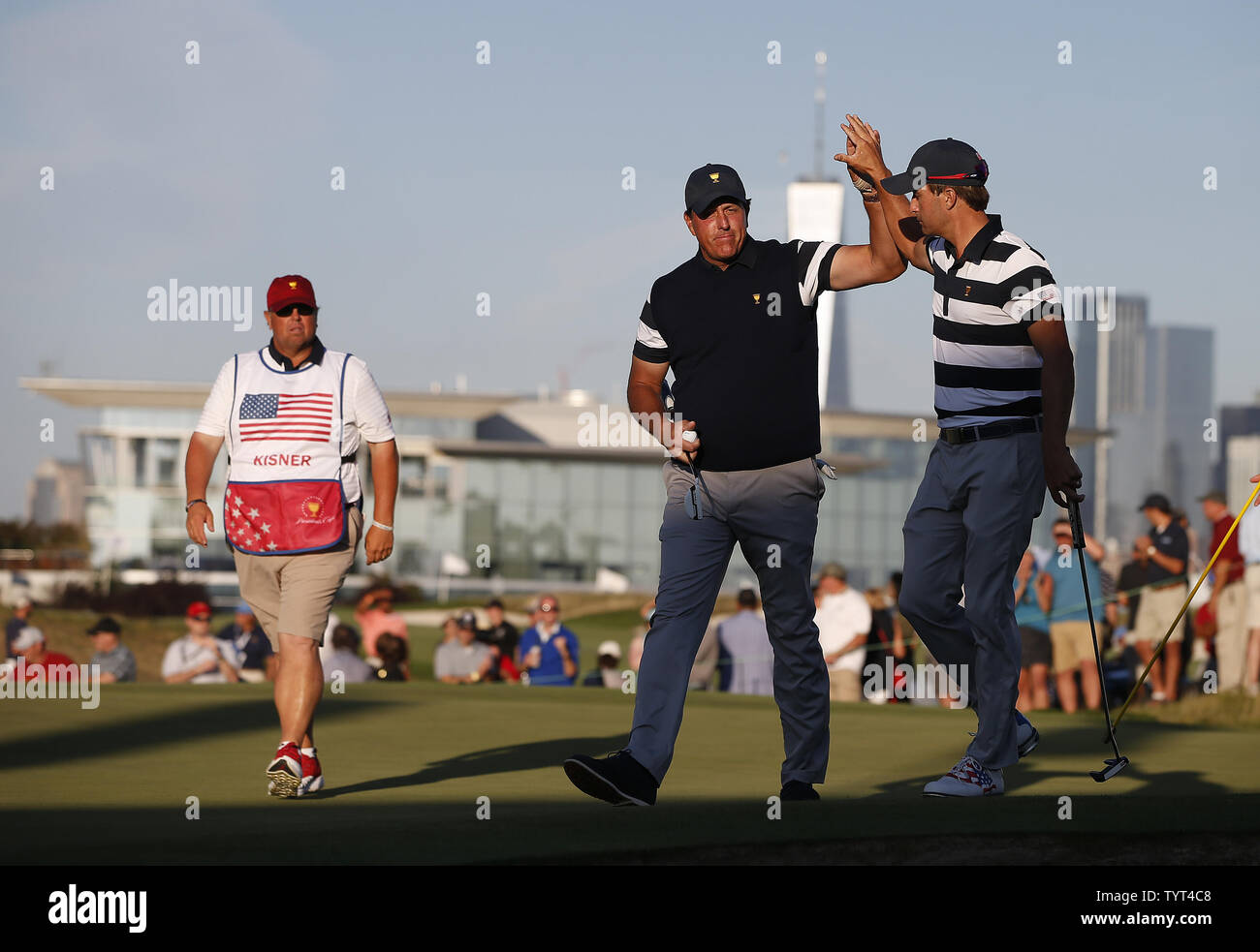 Phil Mickelson, left, and Kevin Kisner of the United States high five ...
