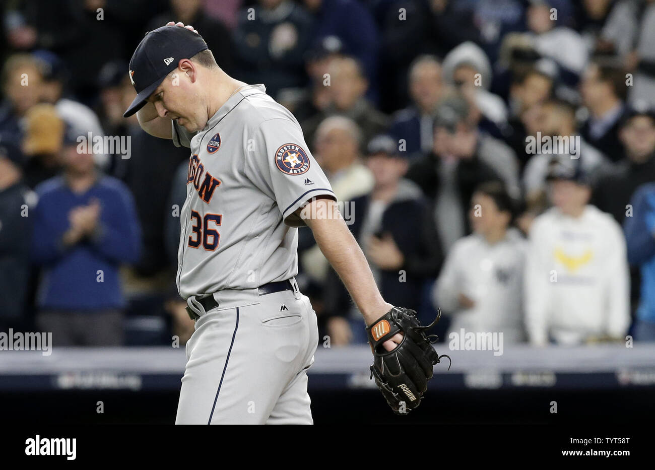 Houston Astros relief pitcher Will Harris reacts after a wild pitch ...