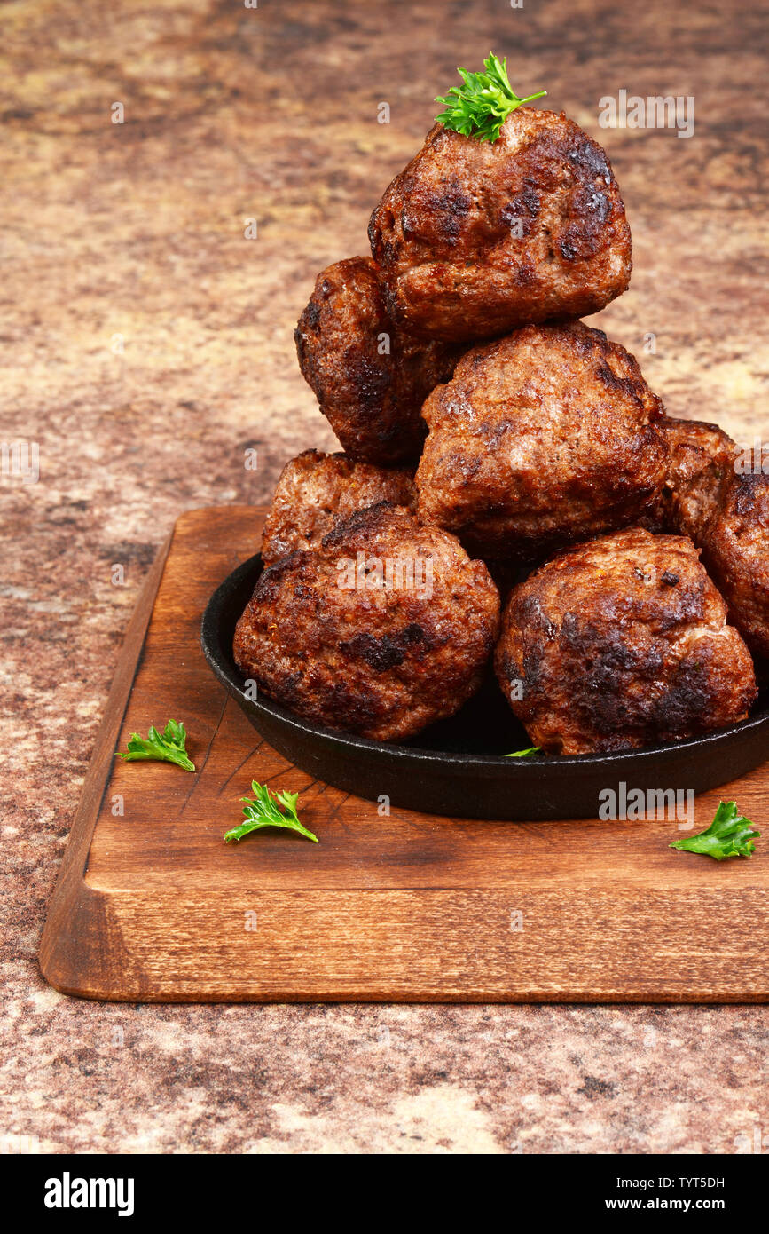 closeup meatballs in cast iron skillet Stock Photo - Alamy
