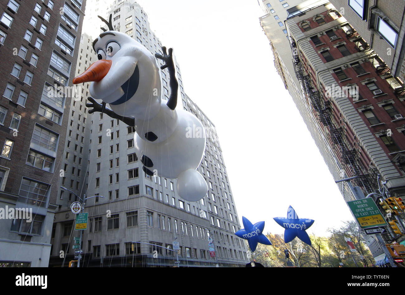 An Olaf from Frozen balloon moves down the parade route at the 91st ...