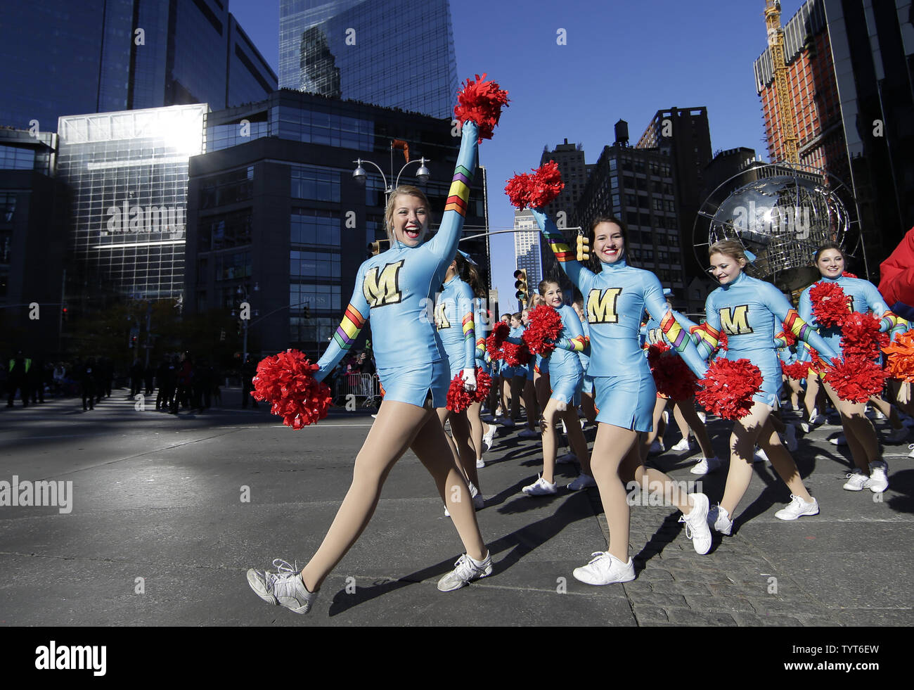 Cheerleaders move down the parade route at the 91st Macy's Thanksgiving ...
