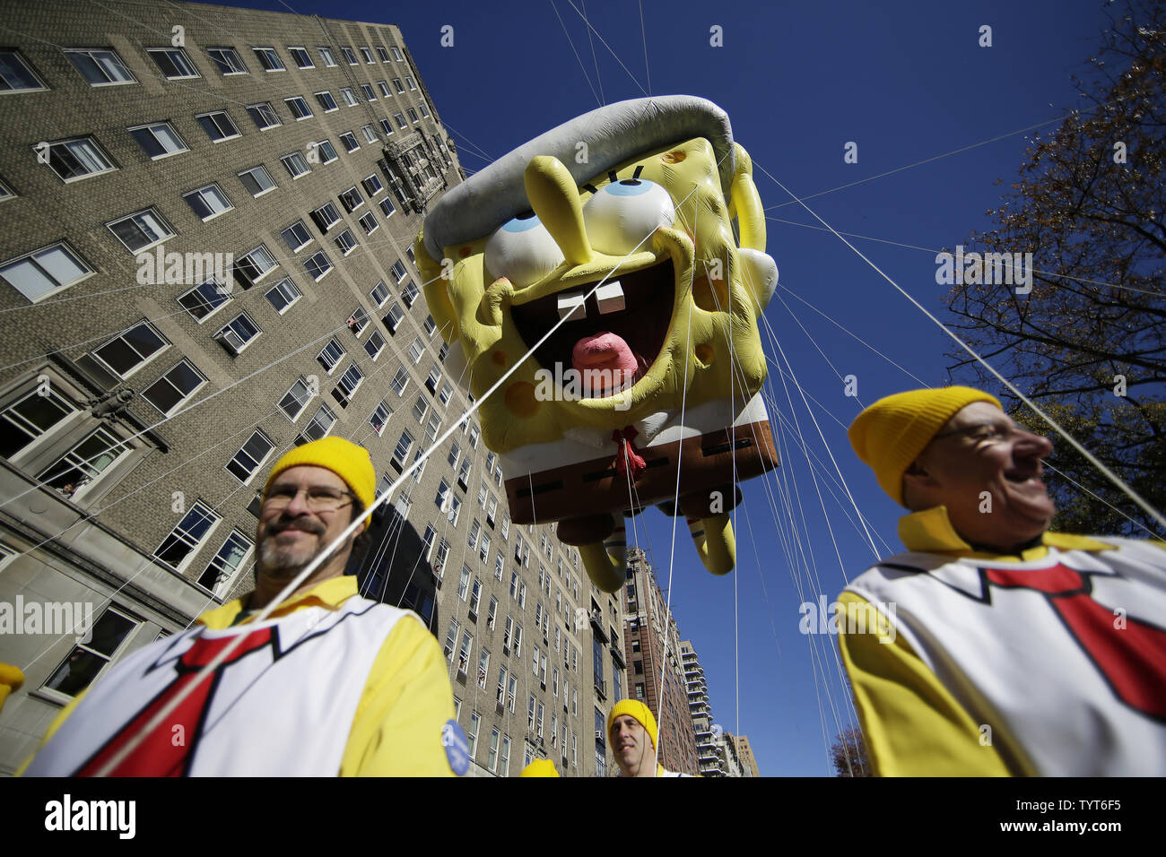 A Spongebob Squarepants balloon moves down the parade route at the 91st ...