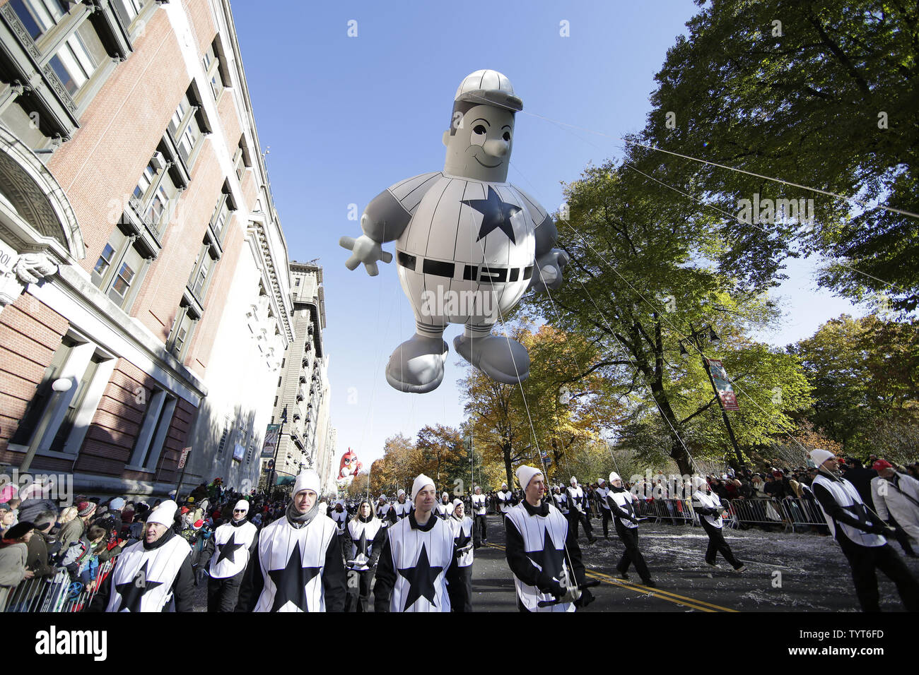 Harold the Baseball Player balloon moves down the parade route at the ...
