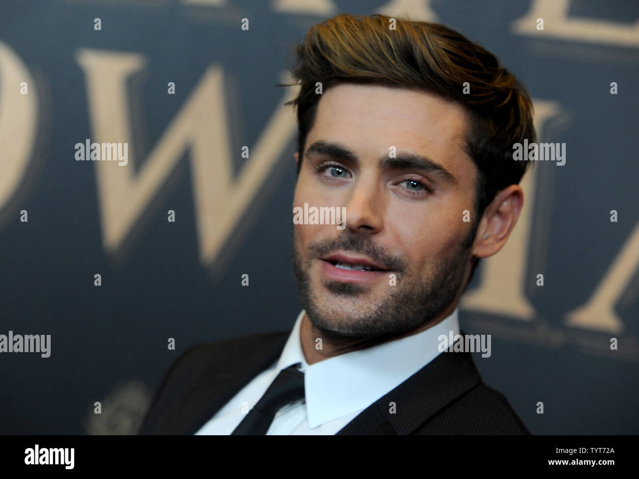 Zac Efron arrives on the red carpet at the 'The Greatest Showman' World ...