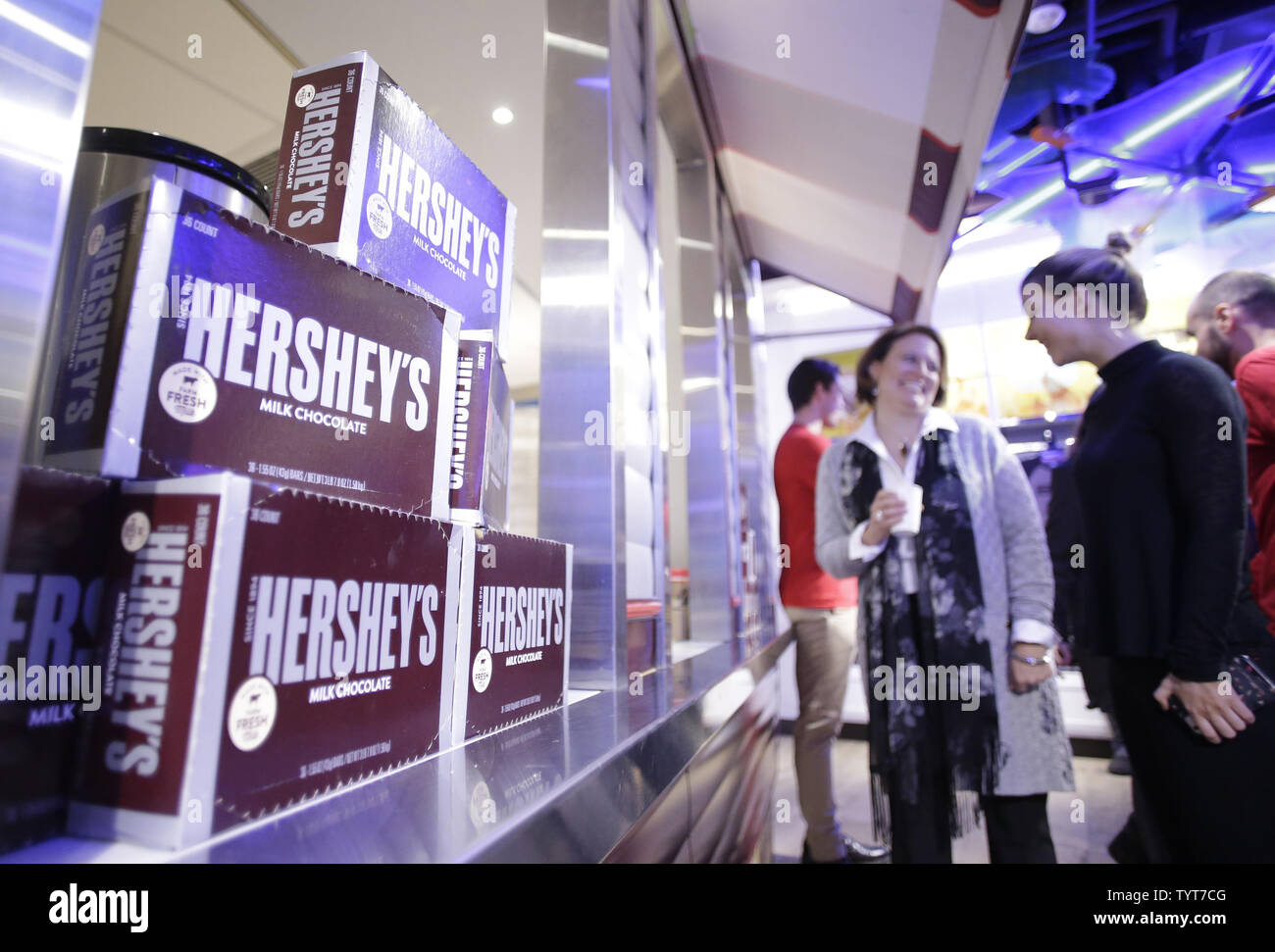Hershey's products are on display as shoppers walk through a new ...