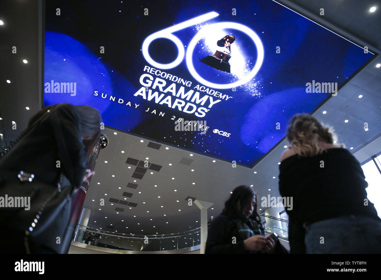 A sign for the 60th Annual Grammy Awards is displayed on a monitor on ...