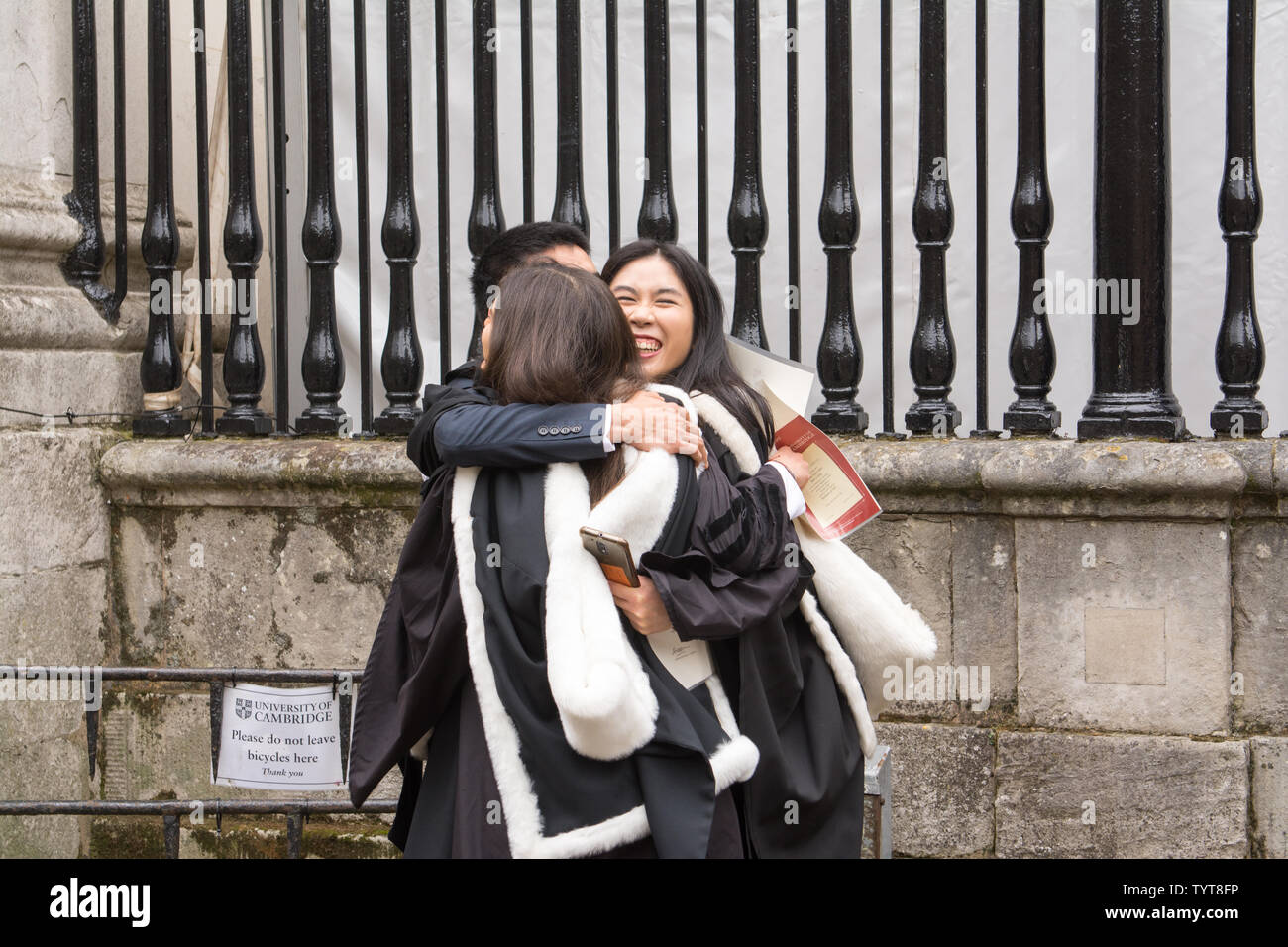 Cambridge uk, 2019-05-18, Two female graduates celebrate and ...