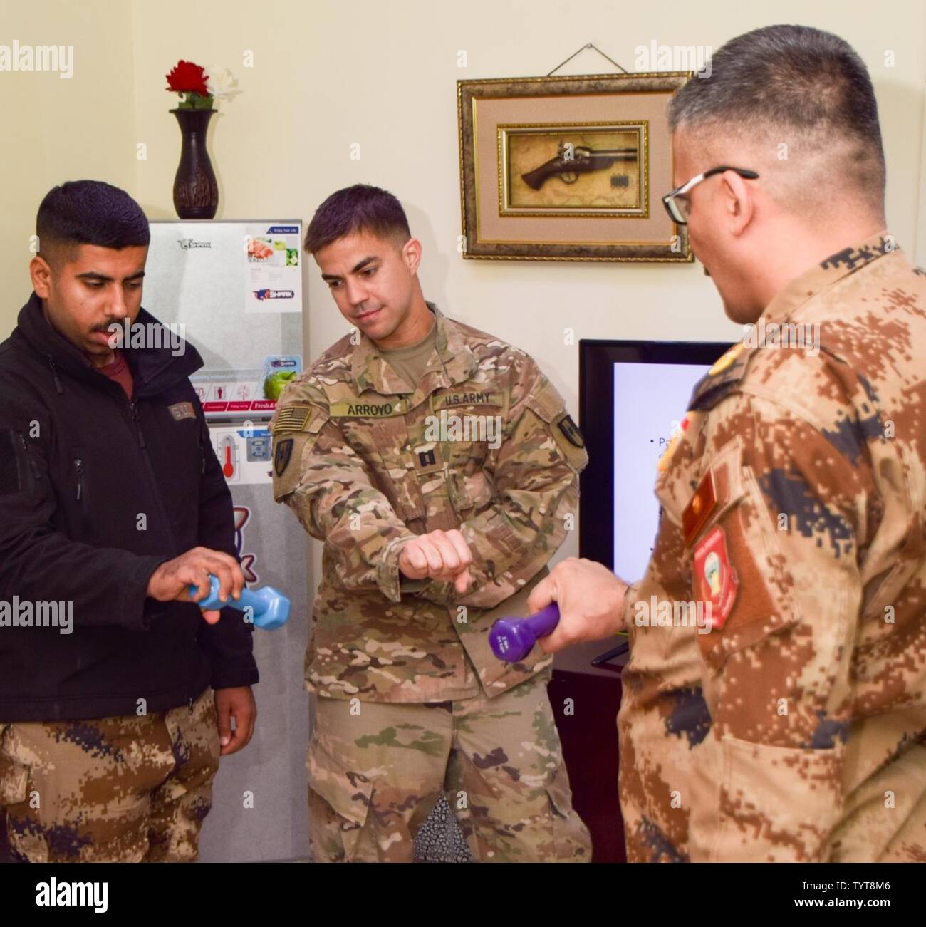 U.S. Army Capt. Sifuentes Arroyo, center, 28th Combat Support Hospital ...