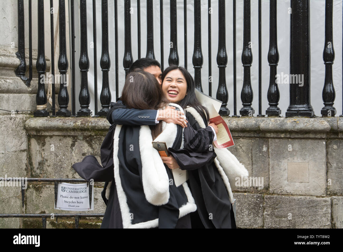 Cambridge uk, 2019-05-18, Two female graduates celebrate and ...