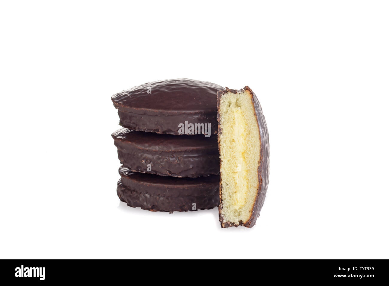 pile of chocolate covered sponge cakes with custard cream filling Stock ...