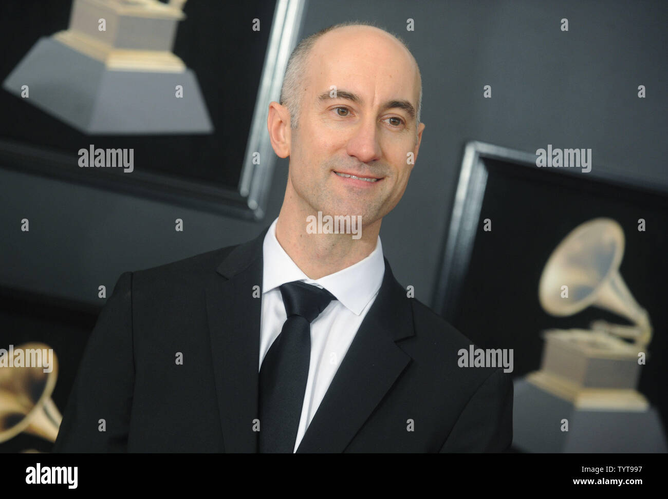 Alan Ferber arrives on the red carpet at the 60th Annual Grammy Awards ...