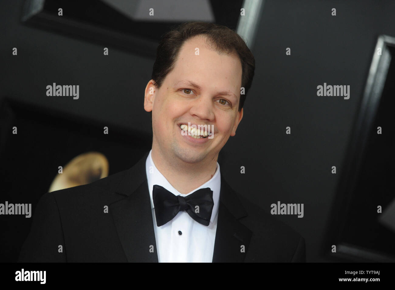 Bryan Wright arrives on the red carpet at the 60th Annual Grammy Awards ...