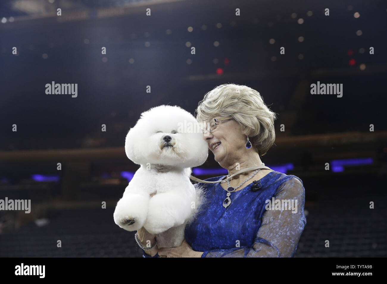 Best in Show Judge Betty Anne Stenmark holds Flynn the Bichon Frise ...