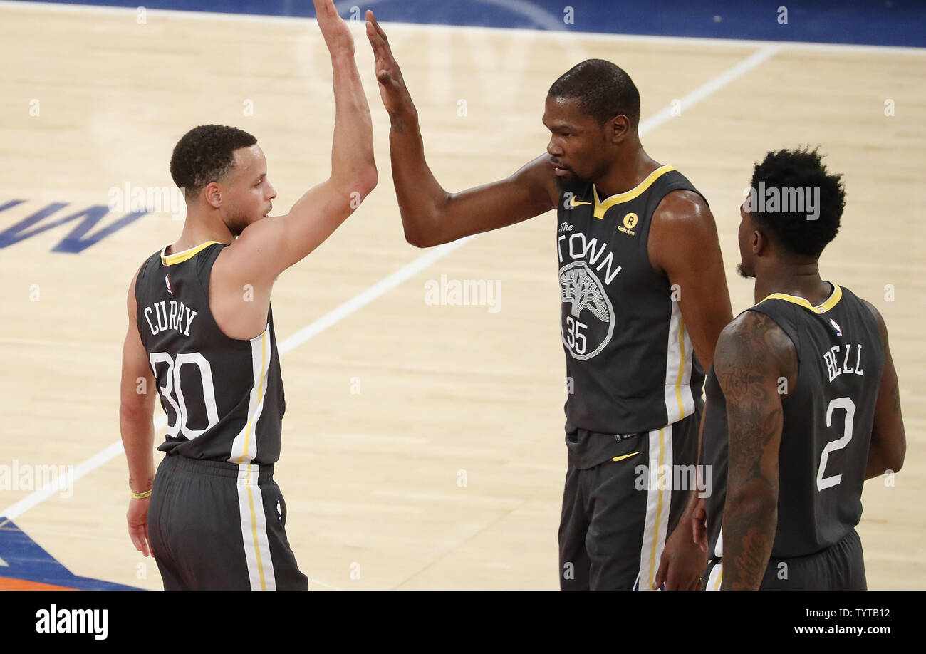 Golden State Warriors Stephen Curry and Kevin Durant high five after a ...