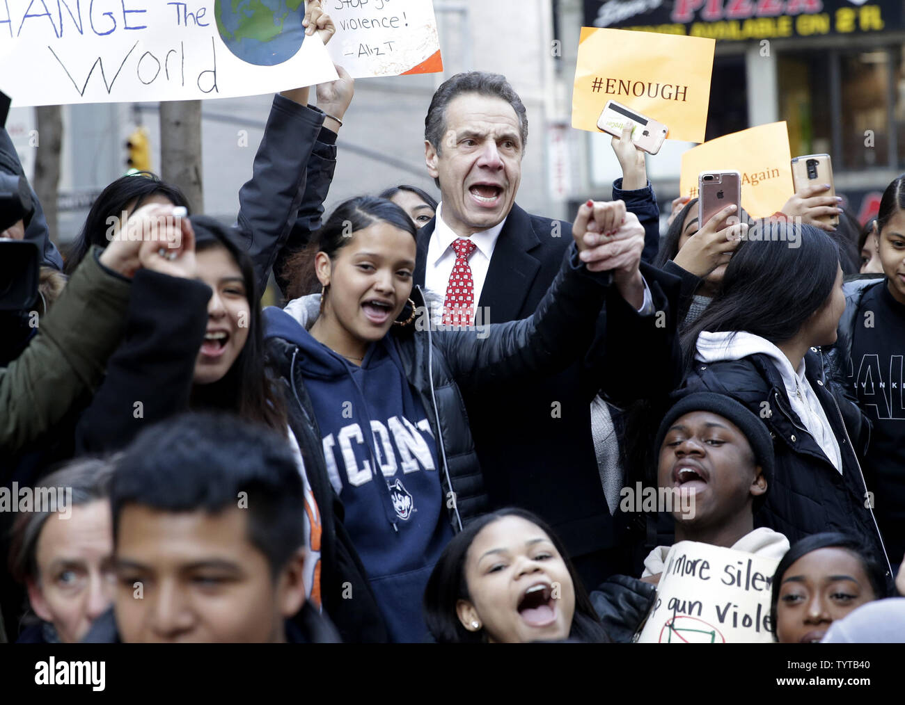 Students from Leadership and Public Service High School hold up signs ...