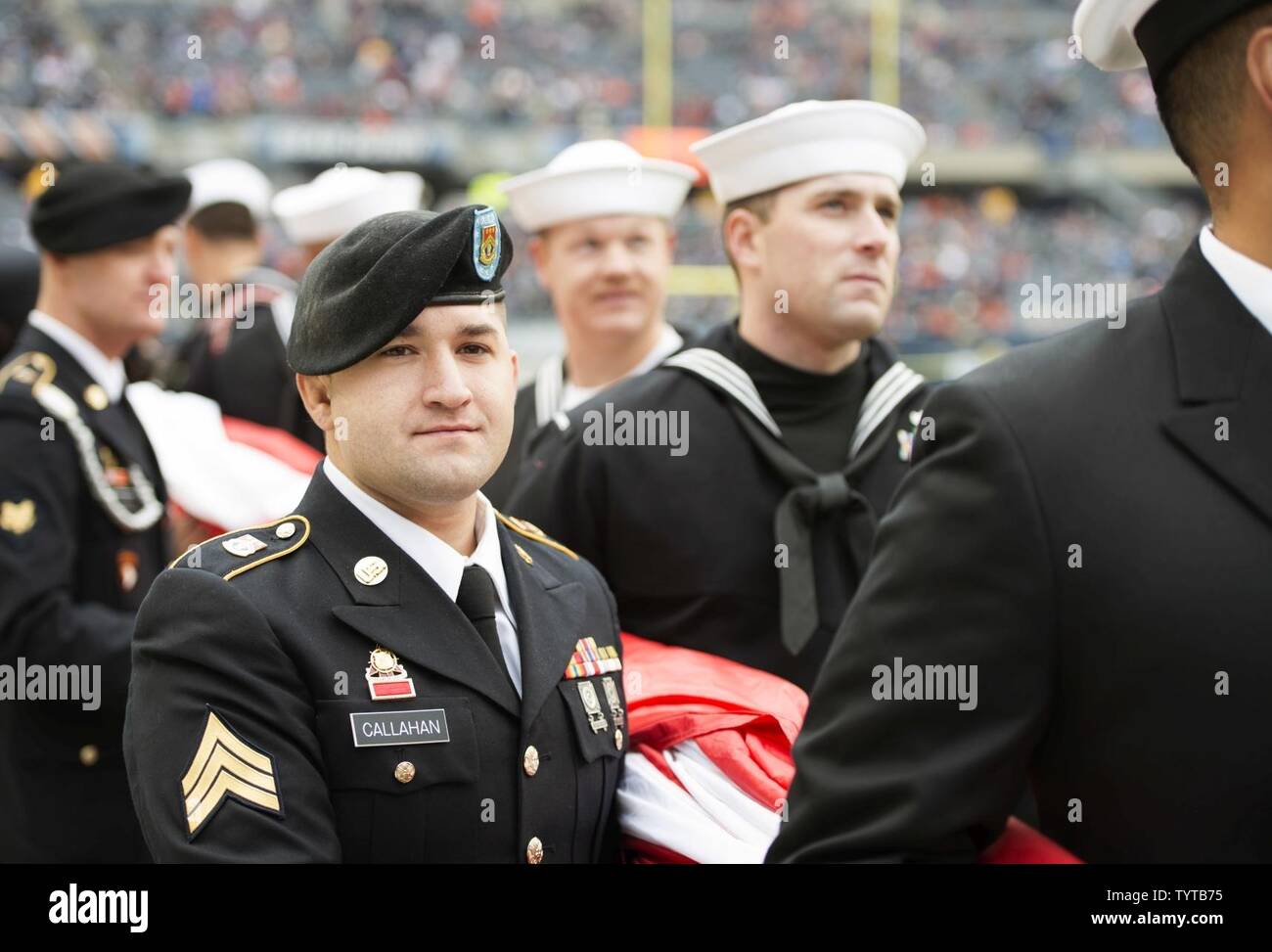 Service members from all five branches of the armed services carry a ...