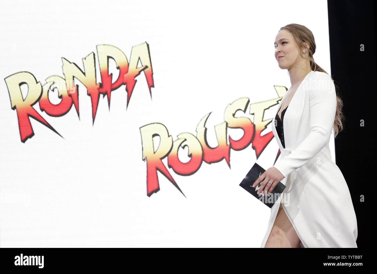 Ronda Rousey arrives to speak at a news conference to officially ...