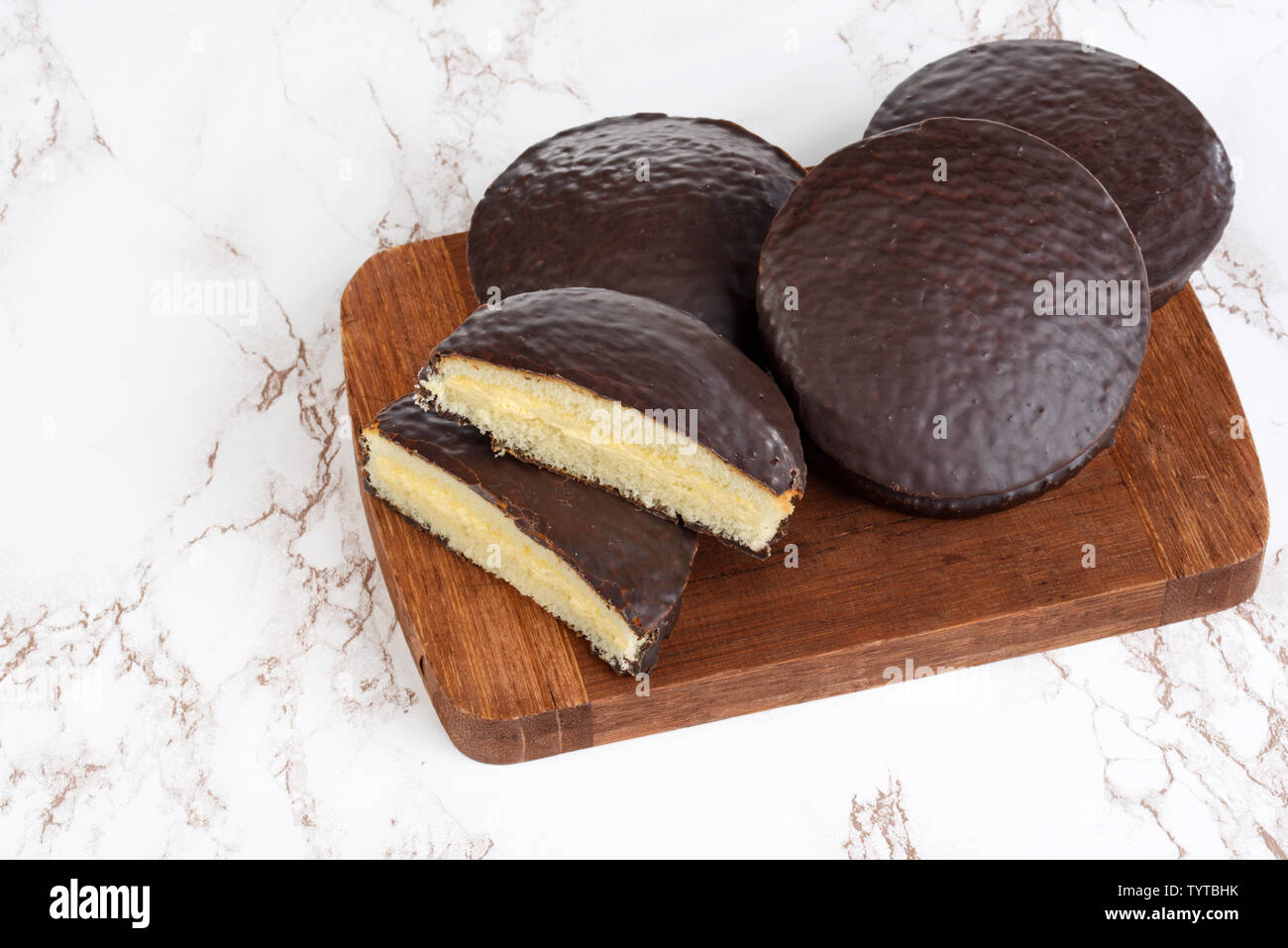 top view custard cream filled chocolate sponge cake Stock Photo - Alamy
