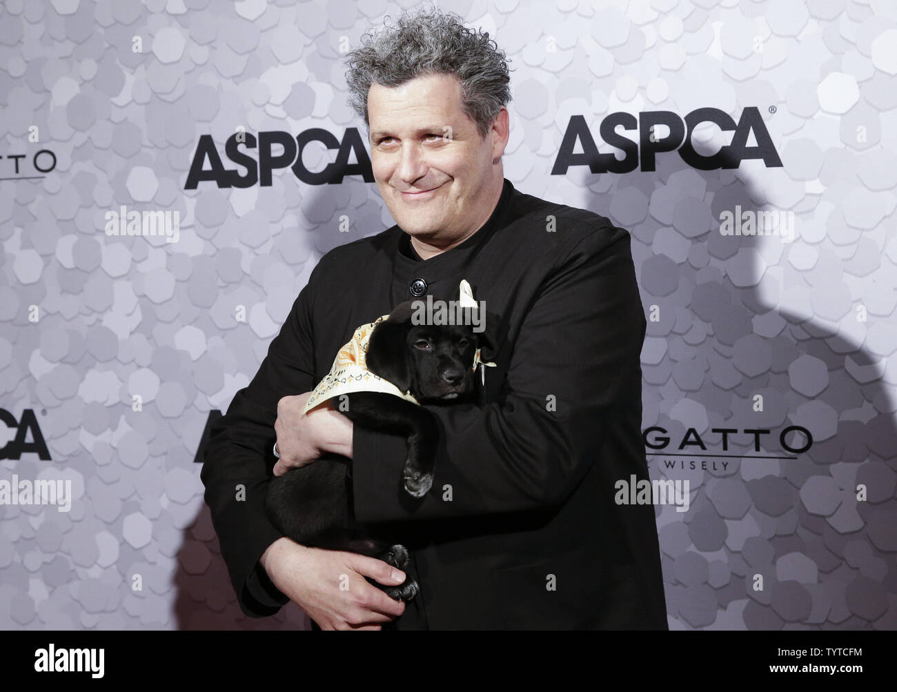 Isaac Mizrahi arrives on the red carpet with a puppy at the 21st Annual ...