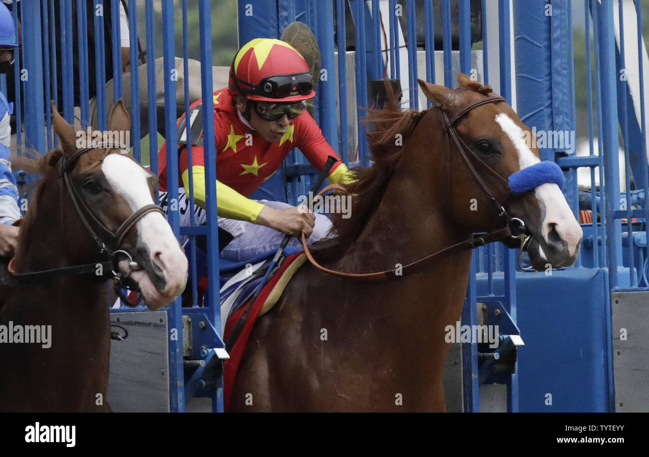Jockey Mike Smith rides Justify who jumps out of the gate to start the ...