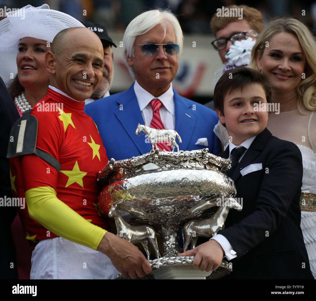 Jockey Mike Smith, trainer Bob Baffert, and Baffert's son Bode pose ...