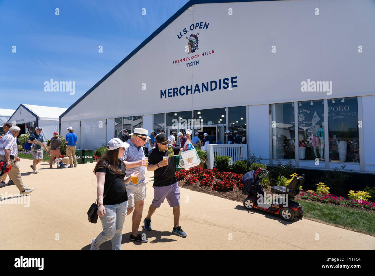 Fans walk by the merchandise tent on the Tuesday before the 118th U.S ...