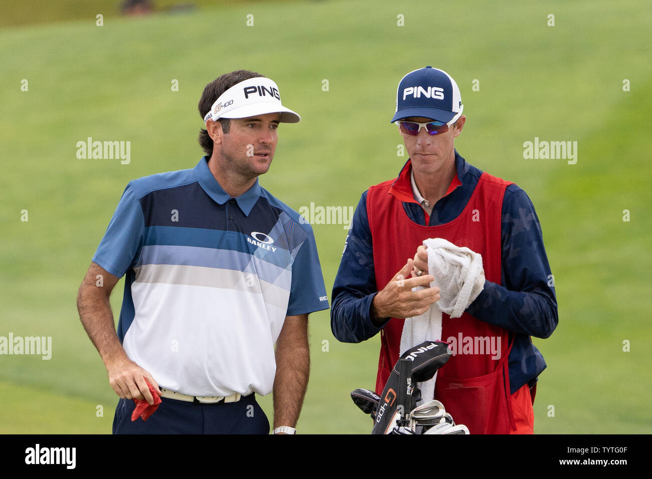 Bubba Watson with caddy John Teddy Scott on the 16th green in the ...
